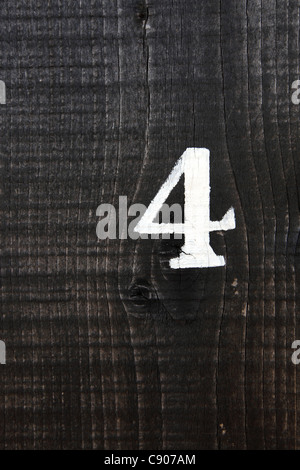 single digit number 2 two stenciled onto stained wooden door, Suffolk ...