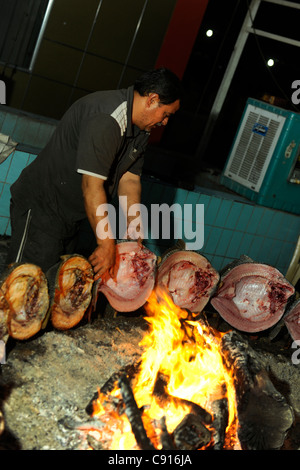 Iraq, Baghdad, Masgouf a Baghdadi fish speciality served in a row of ...