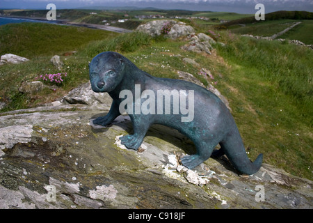 Gavin Maxwell memorial, a bronze otter on rocks at Monreith in Dumfries ...