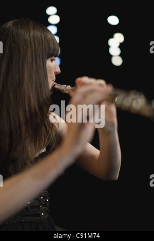 Flute player in orchestra Stock Photo - Alamy