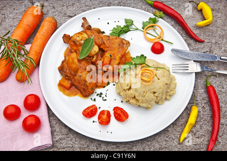 Rabbit with polenta, served on the terrace of a Ticino Grotto Stock ...