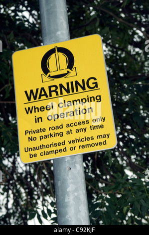 Car wheel clamp clamping warning sign release charge parking ticket fee ...