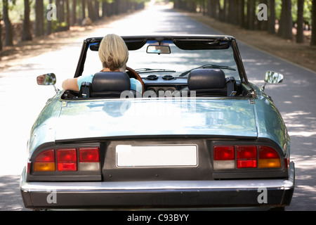 Woman driving a convertible, open top, Mercedes sports car Stock Photo ...