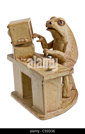 Pottery ornament depicting a frog using a computer Stock Photo - Alamy