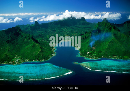 Aerial view of Cooks Bay and mountains on Island of Moorea swimming ...