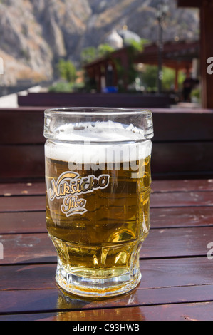A pint glass of Nikšićko lager beer, Old Town, Kotor, Bay of Kotor ...