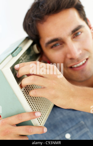 Man tuning the radio Stock Photo - Alamy