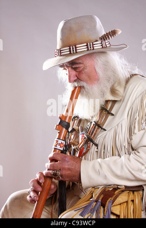 Native American man with flute, Sioux History interpreter at Fort ...