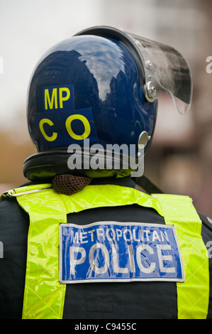 Police officer in a riot helmet demonstration protest in London, UK ...