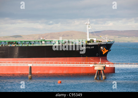 An oil tanker loading with crude oil at the Flotta oil terminal in the ...