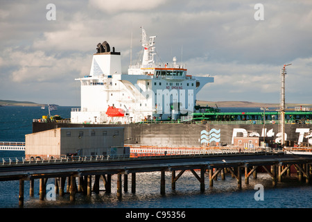 An oil tanker loading with crude oil at the Flotta oil terminal in the ...