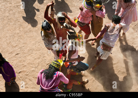 Cora Indians, wearing colorful masks, run during the religious ritual ...