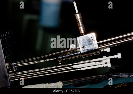A Mick applicator being used to implant radioiodine seeds into a ...