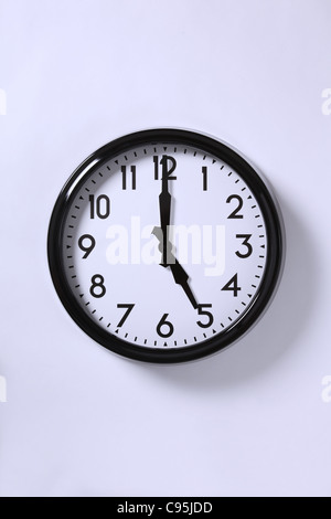 A wall clock at 11 exactly Stock Photo - Alamy