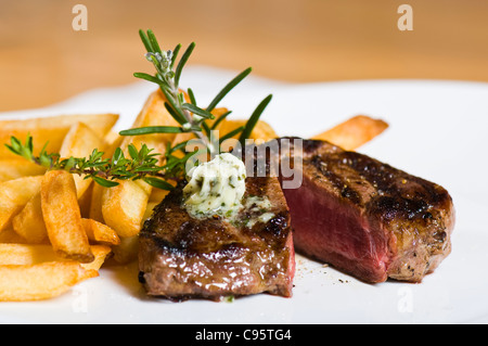 Wild boar steak with herb butter Stock Photo - Alamy