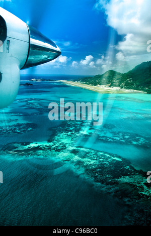 Aerial view of a Seychelles island airport runway with lush green ...
