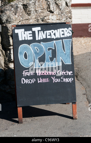 Sign - Husband Creche - outside pub Stock Photo - Alamy