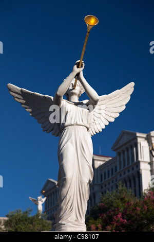 Angel playing golden bugle Stock Photo - Alamy