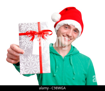 happy man in santa hat holding something imaginary Stock Photo - Alamy
