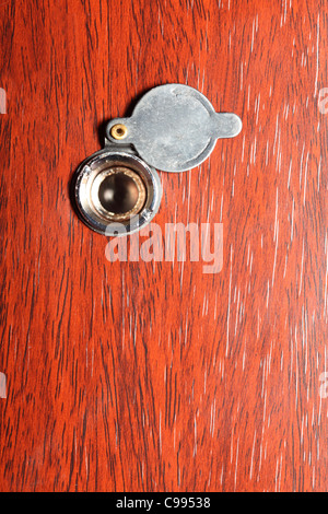 Peephole on wooden door - judas hole spyhole Stock Photo - Alamy