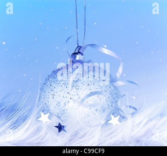 Christmas tree toy, shining silver deer standing on a black background ...