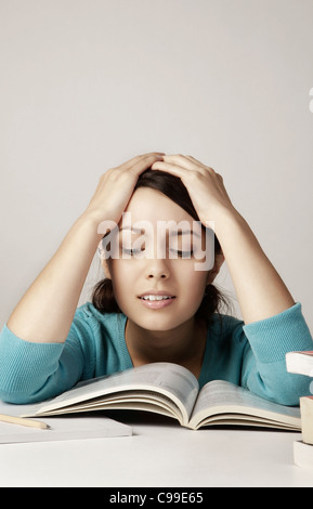 student looking at all her work and finding hard to do and understand ...