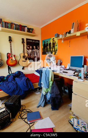 Messy room, student room with a guitar Stock Photo - Alamy