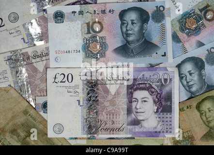 British Pound and Chinese Yuan, bank notes and coins Stock Photo - Alamy