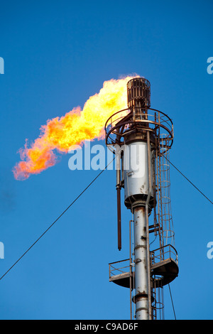 Flaring off gas at the Flotta oil terminal on the Island of Flotta in ...