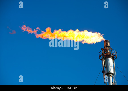 Flaring off gas at the Flotta oil terminal on the Island of Flotta in ...