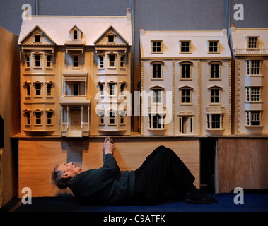 A miniatura enthusiast working on his Pennsylvanian style villa dolls ...