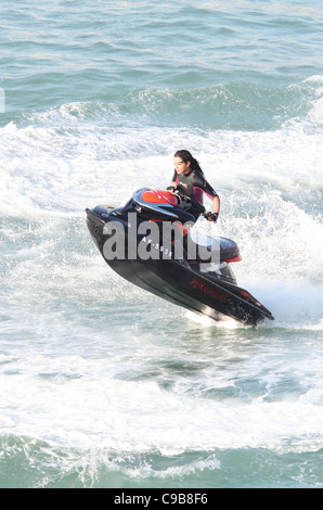 A Jet Skier jumping waves. Picture by James Boardman Stock Photo - Alamy