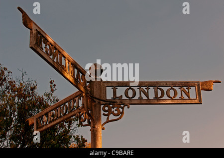 An old fashioned road sign or finger post, Wales, UK, points to Stock ...