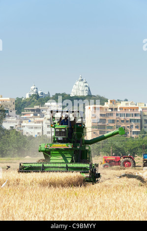 Indian combine harvester harvesting rice crop. Andhra Pradesh, India ...