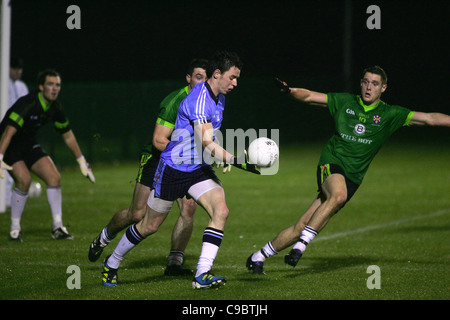 two football players striking the ball Stock Photo - Alamy