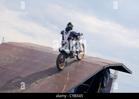 Stunt style - motorcycles trick Stock Photo - Alamy