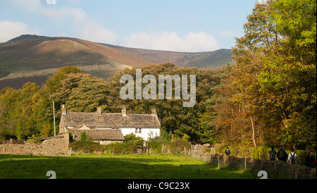 A cottage at Grindsbrook Booth, Edale, with the Kinder Scout plateau ...