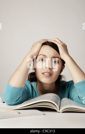 student looking at all her work and finding hard to do and understand ...