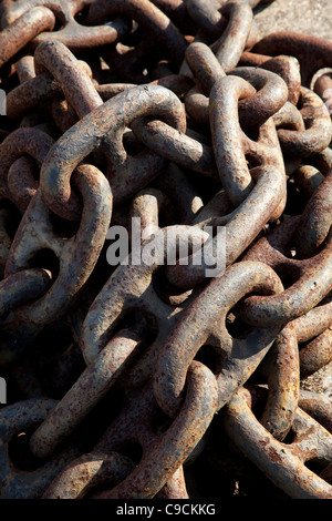 Rusty Chain Links. A pile of large rusting chain links that once formed ...