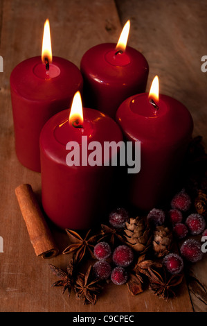 Burning candles on wooden table Stock Photo - Alamy