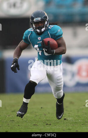 Jacksonville Jaguars running back DuJuan Harris, left, is tapped down ...