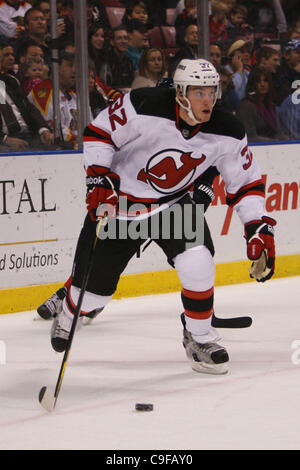 New Jersey Devils defenseman Ben Lovejoy (12) battles for the puck with ...