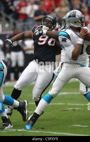 Houston Texans defensive end Tim Jamison celebrates after stripping ...