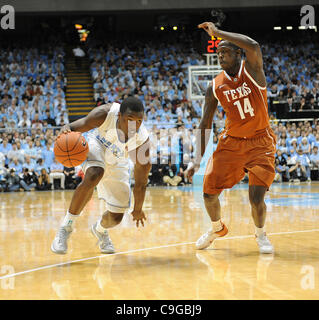 Texas' J'Covan Brown (14) drives as Iowa State's Royce White, left ...