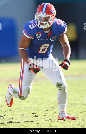 Florida State running back Trey Benson (3) is tackled by LSU safety ...