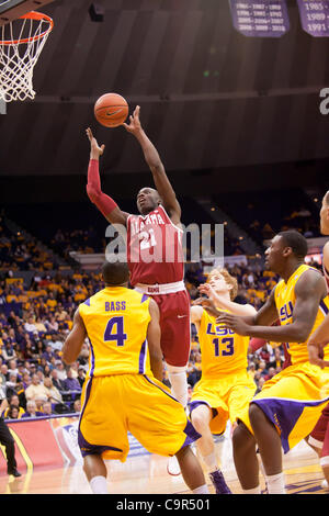 Alabama guard Rodney Cooper (21) battles to get off a shot as Towson ...