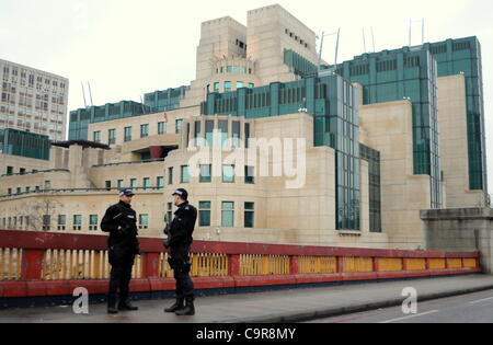 London, UK. 12/02/12. Actors dressed as armed police in a scene from ...