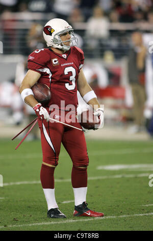 Arizona Cardinals kicker Jay Feely, left, kicks a 35-yard field goal as ...