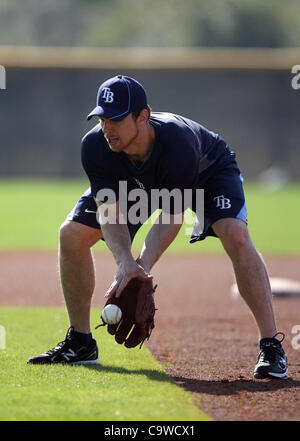 Tampa Bay Rays' Ben Zobrist dives back to first base ahead of the throw ...
