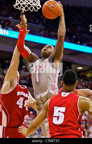 Wisconsin forward Frank Kaminsky tries to go around Iowa center Adam ...